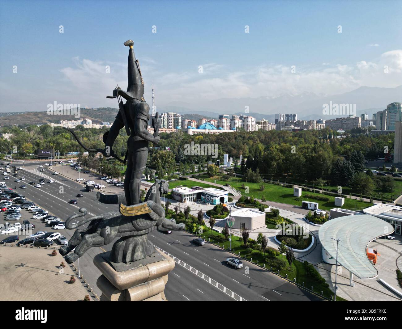 The central square and the monument with the Golden Man Stock Photo - Alamy