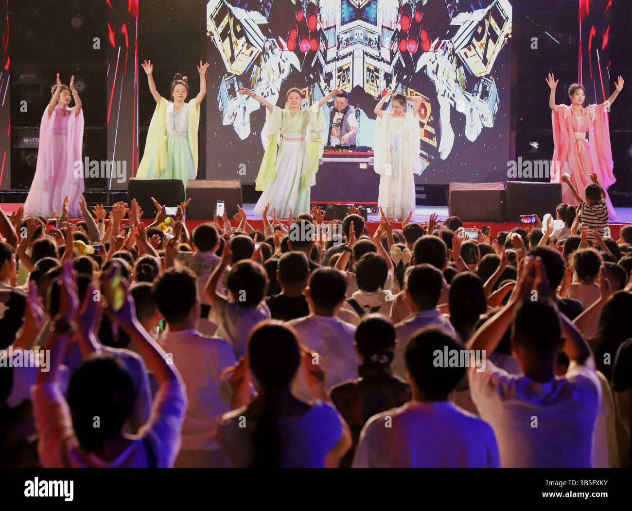 Beijing, China's Henan Province. 1st May, 2025. Tourists interact with ...