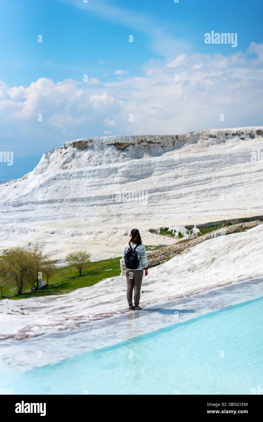Tourist admiring Pamukkale thermal travertines pools in Turkey Stock ...