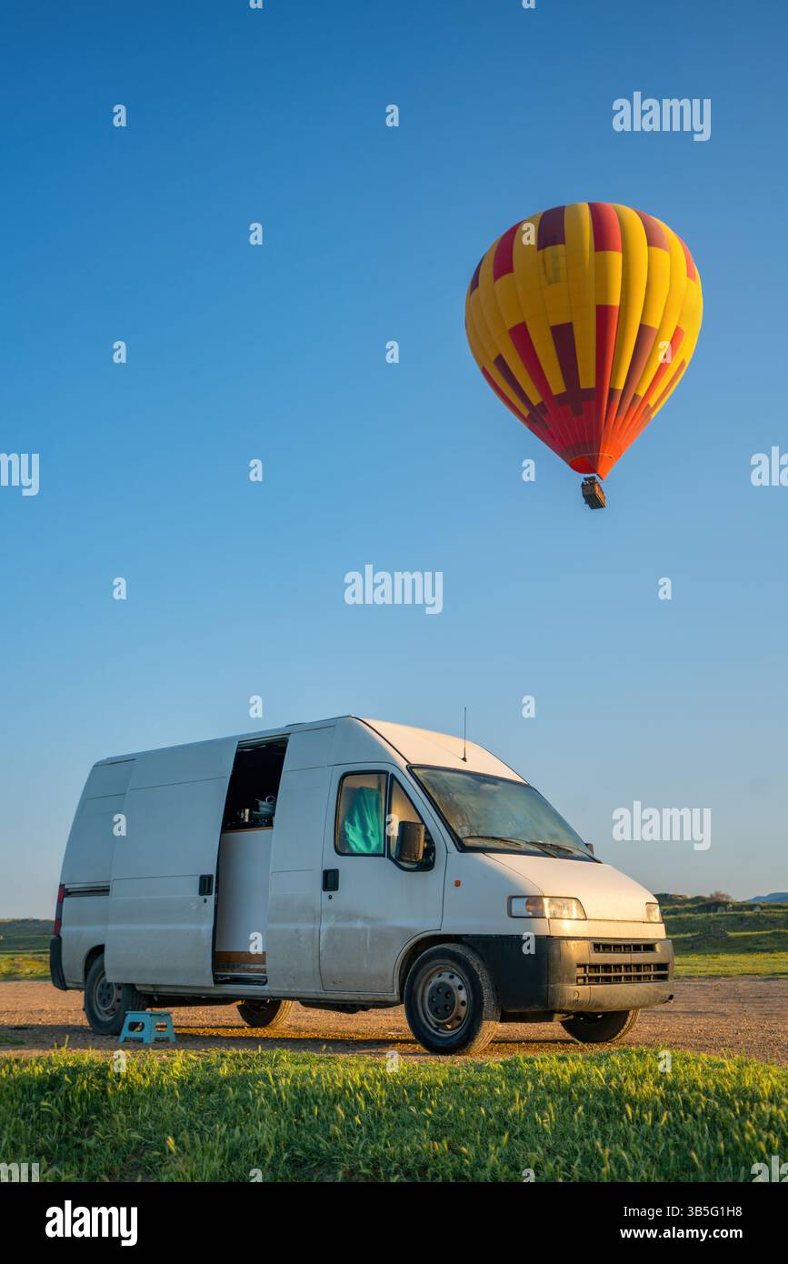 Hot air balloon flying over a camper van in Pamukkale Stock Photo - Alamy