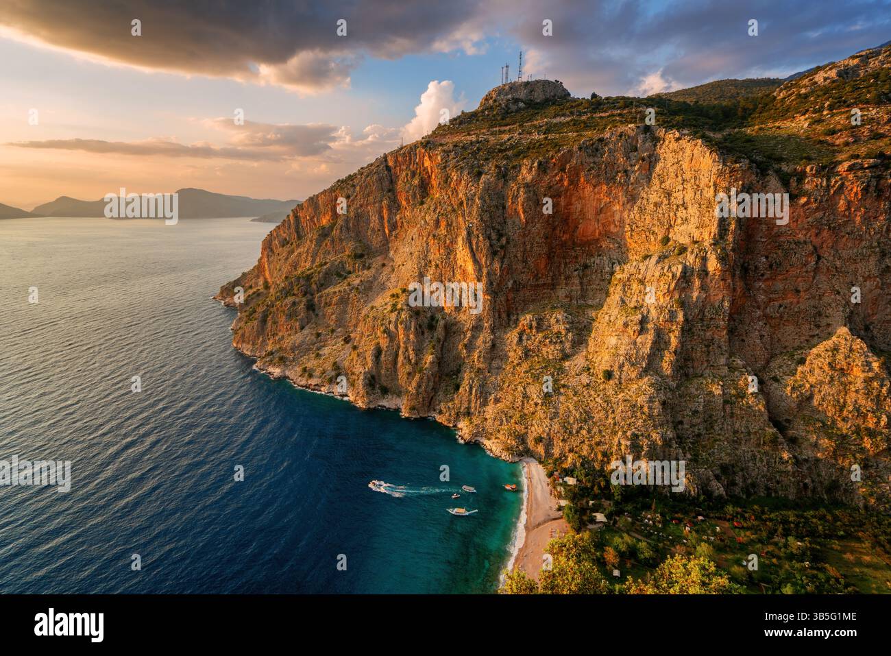 Butterfly Valley beach glowing at sunset in Fethiye Stock Photo - Alamy