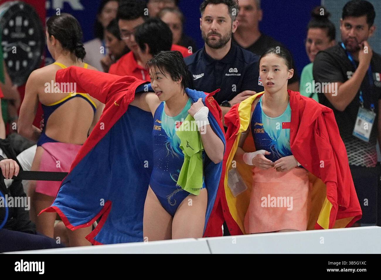 China's Quan Hongchan and Chen Yuxi, react after winning the Women's ...