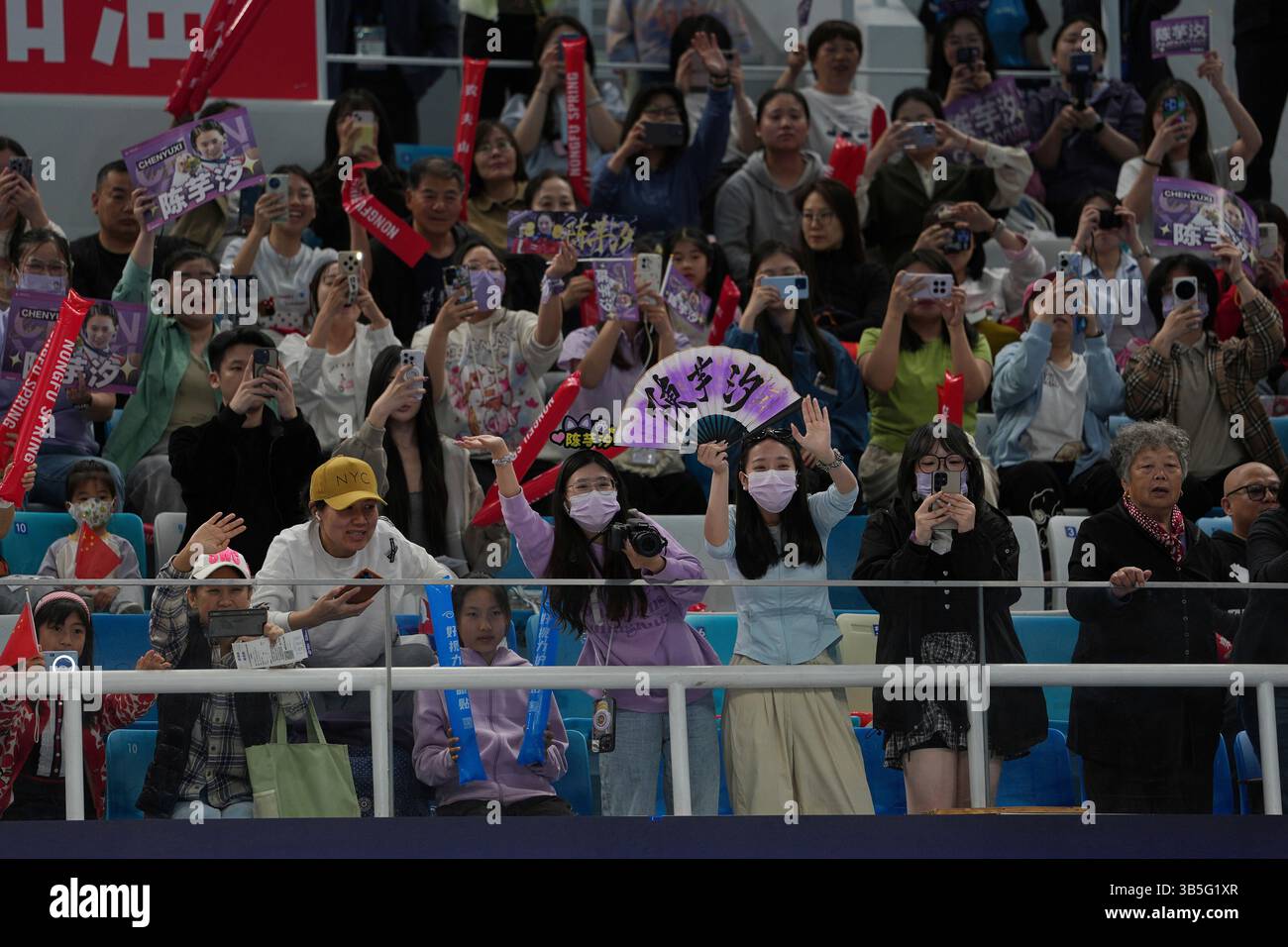 Fans of China's Quan Hongchan and Chen Yuxi, cheer before the Women's ...