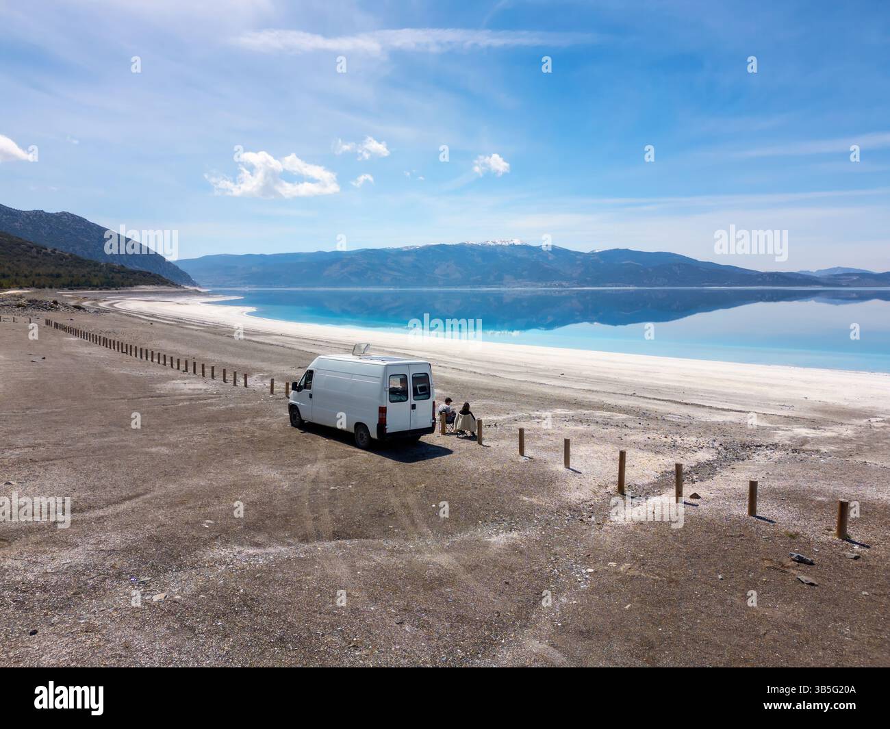 Camper van parked by turquoise water Salda Lake in Turkey Stock Photo ...