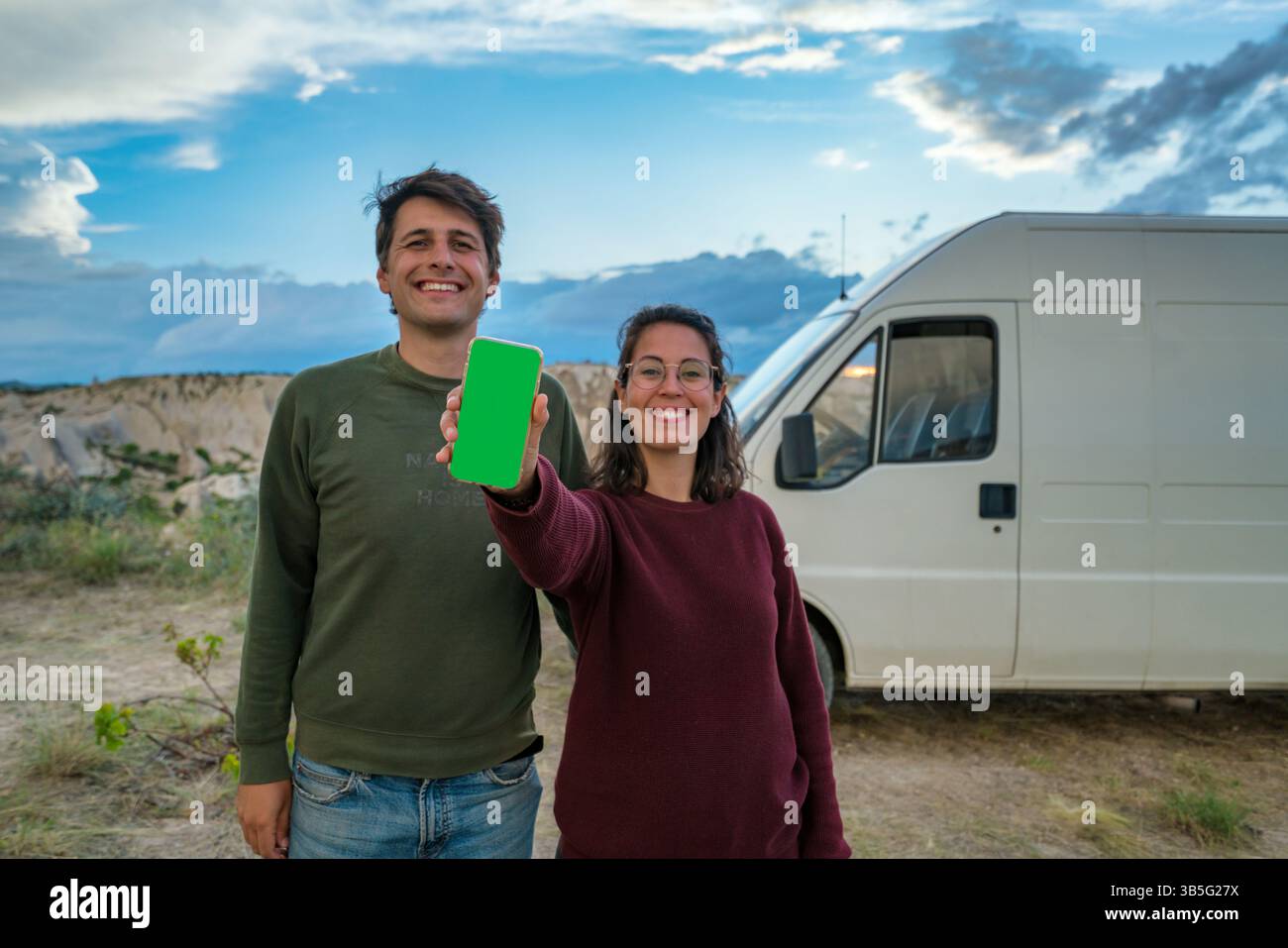 Digital nomad couple enjoying van life Stock Photo - Alamy