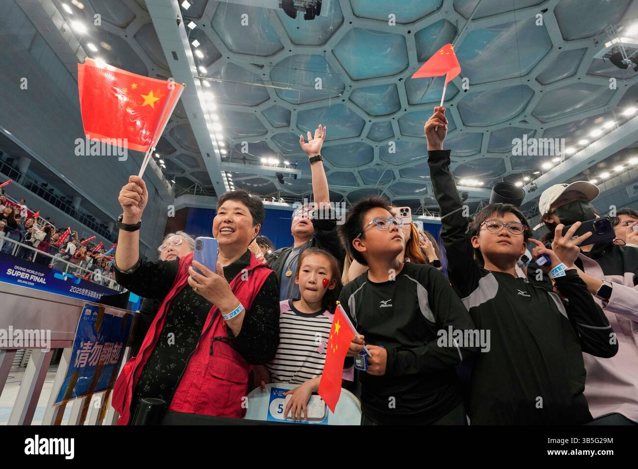 Fans of China's Quan Hongchan and Chen Yuxi, cheer after the Women's ...