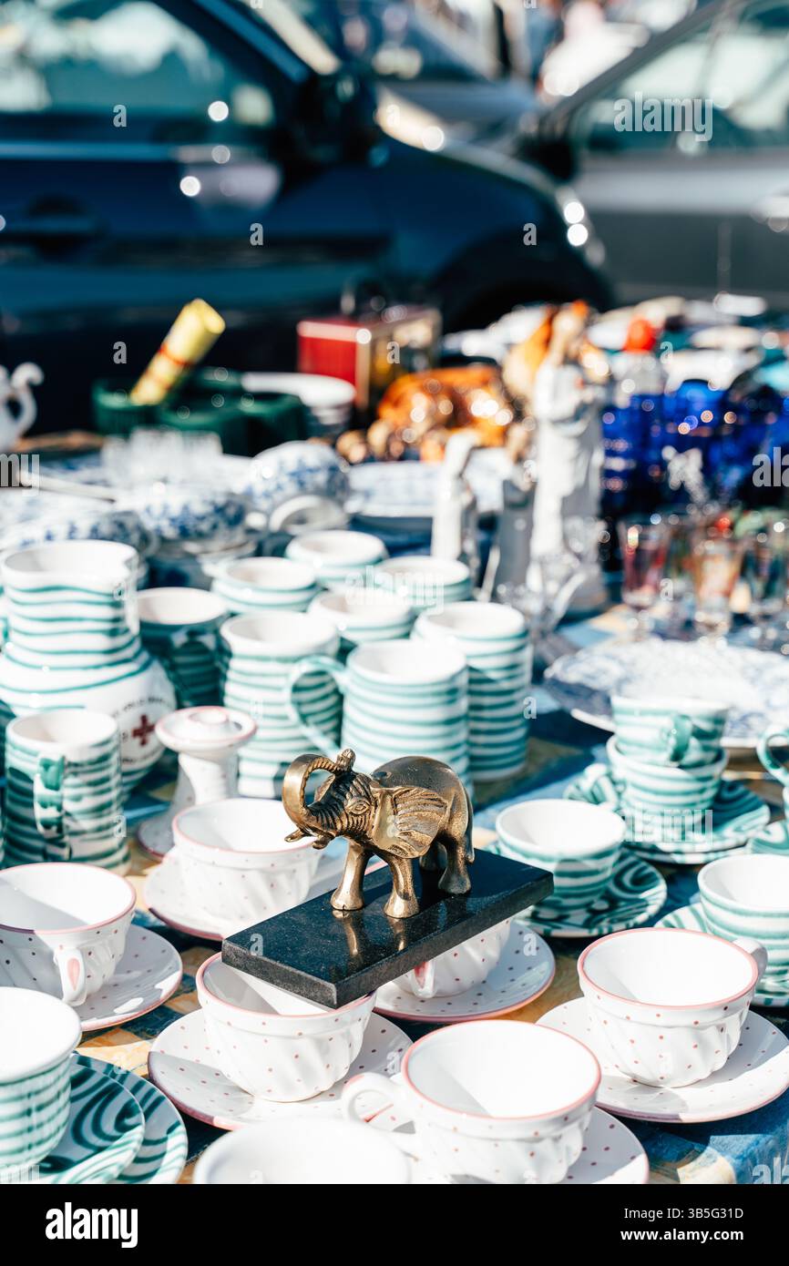 Flea market table filled with vintage items and collectibles in Stock ...