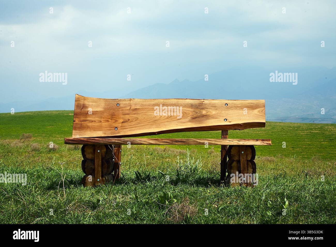 Rustic wooden bench on a scenic viewpoint near Champagne village ...