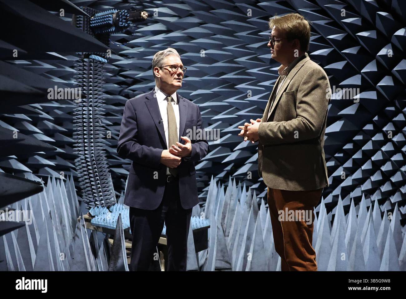 Prime Minister Sir Keir Starmer (left) is shown an anechoic chamber ...