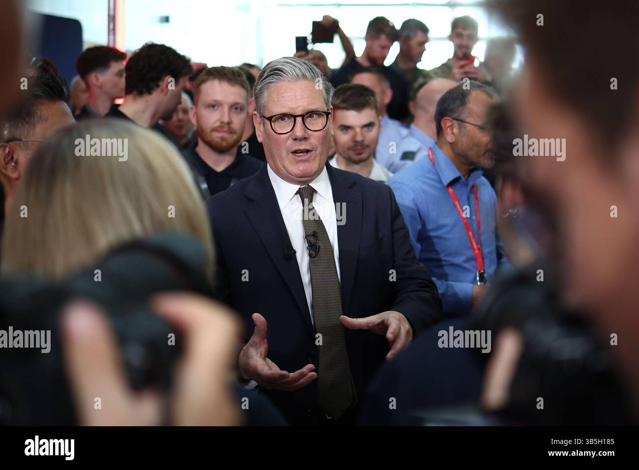 Prime Minister Sir Keir Starmer speaks to members of staff during a ...