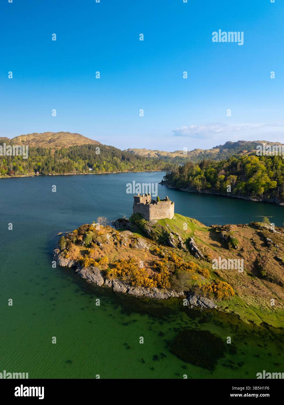 Aerial view from drone of Castle Tioram, a ruined castle on the tidal ...