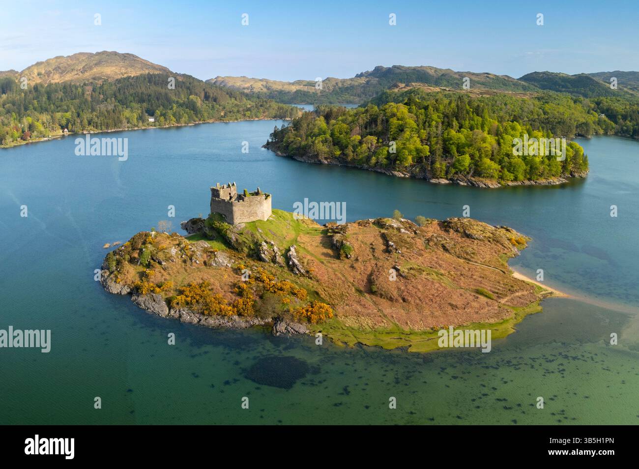 Aerial view from drone of Castle Tioram, a ruined castle on the tidal ...