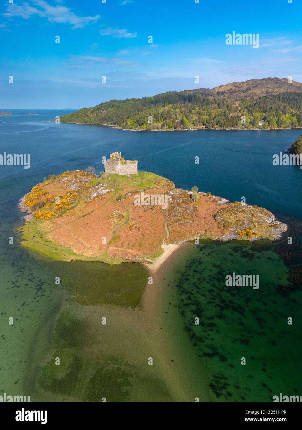 Aerial view from drone of Castle Tioram, a ruined castle on the tidal ...