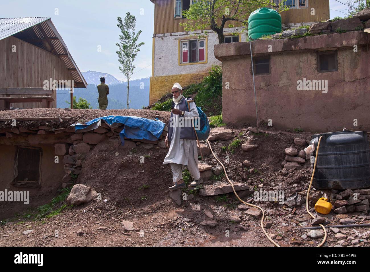 A Kashmiri villager walks past a bunker at Churunda village, near the Line of Control, north of ...