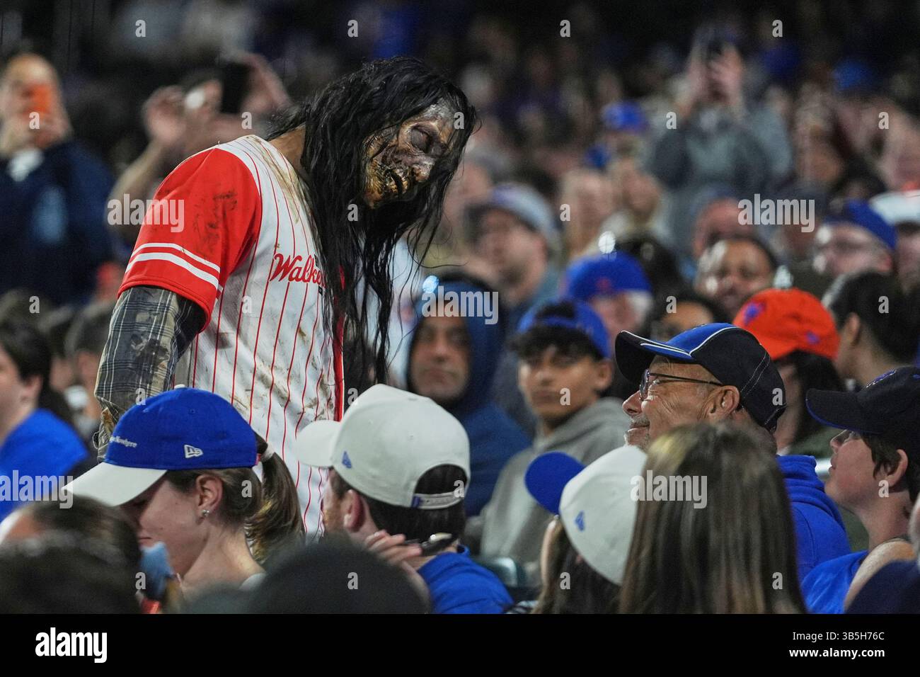 Fans watch as an actor portraying a zombie from the television series ...