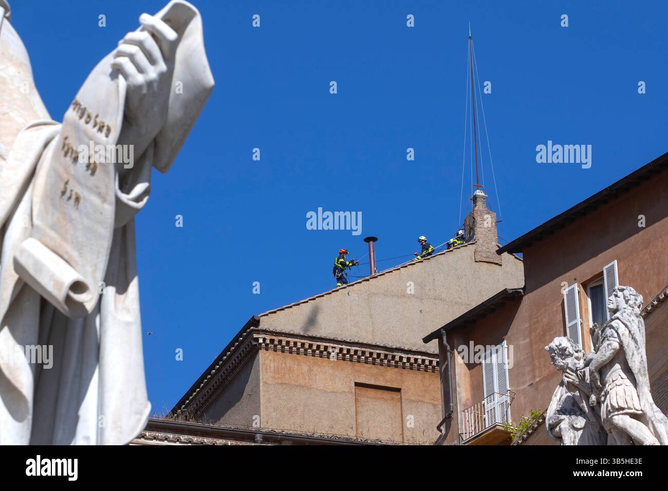 Vatican City, Vatican, 02 May 2025. Firefighters install the chimney on ...