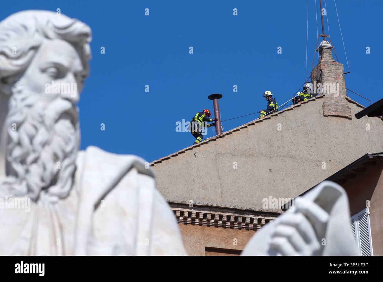 Vatican City, Vatican, 02 May 2025. Firefighters install the chimney on ...