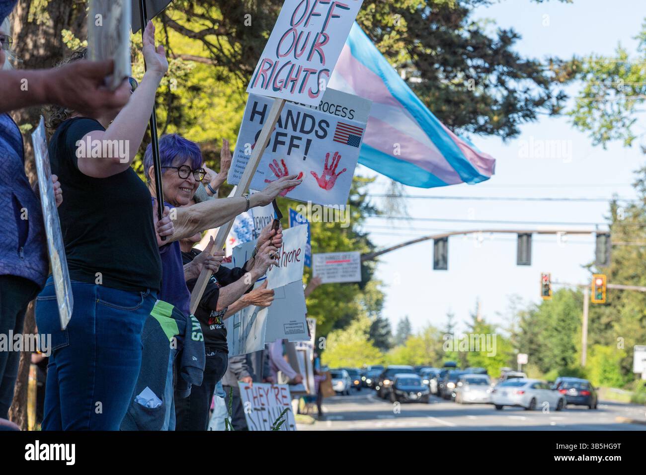 Demonstrators line the streets of Lake Forest Park, Washington on May 1 ...