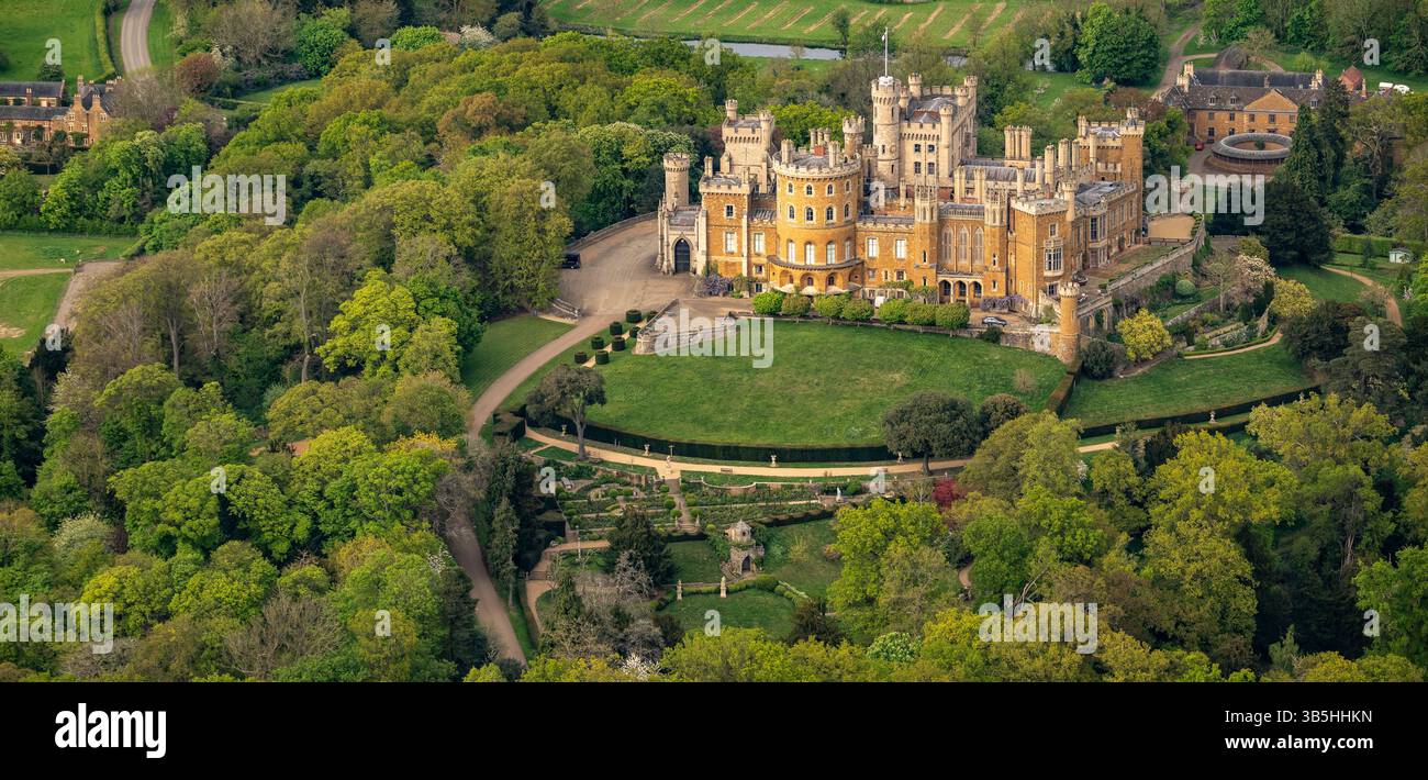 Aerial photograph of Belvoir Castle surrounded by trees in full leaf ...