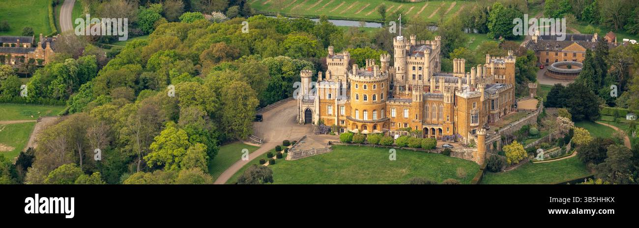 Aerial photograph of Belvoir Castle surrounded by trees in full leaf ...