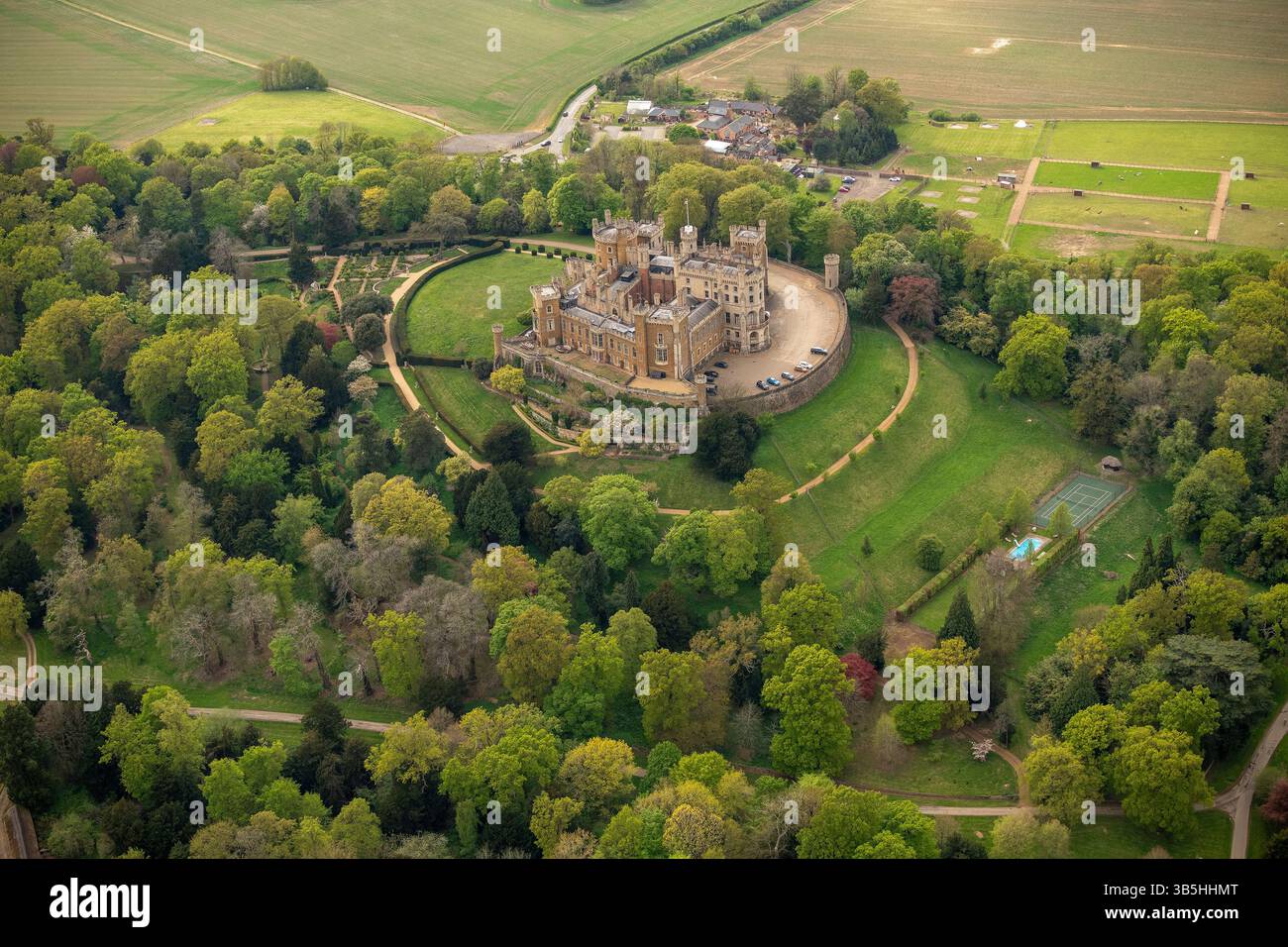 Aerial photograph of Belvoir Castle surrounded by trees in full leaf ...