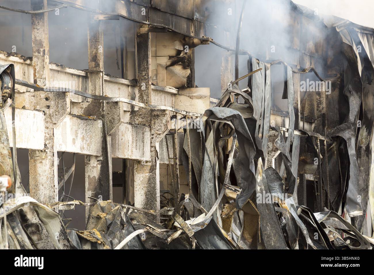 Fire disaster in a warehouse. Fire fighting in an industrial area Stock ...