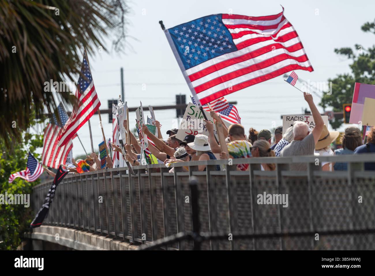 May 1, 2025: Protesters line an overpass in St. Petersburg, F.L. as ...
