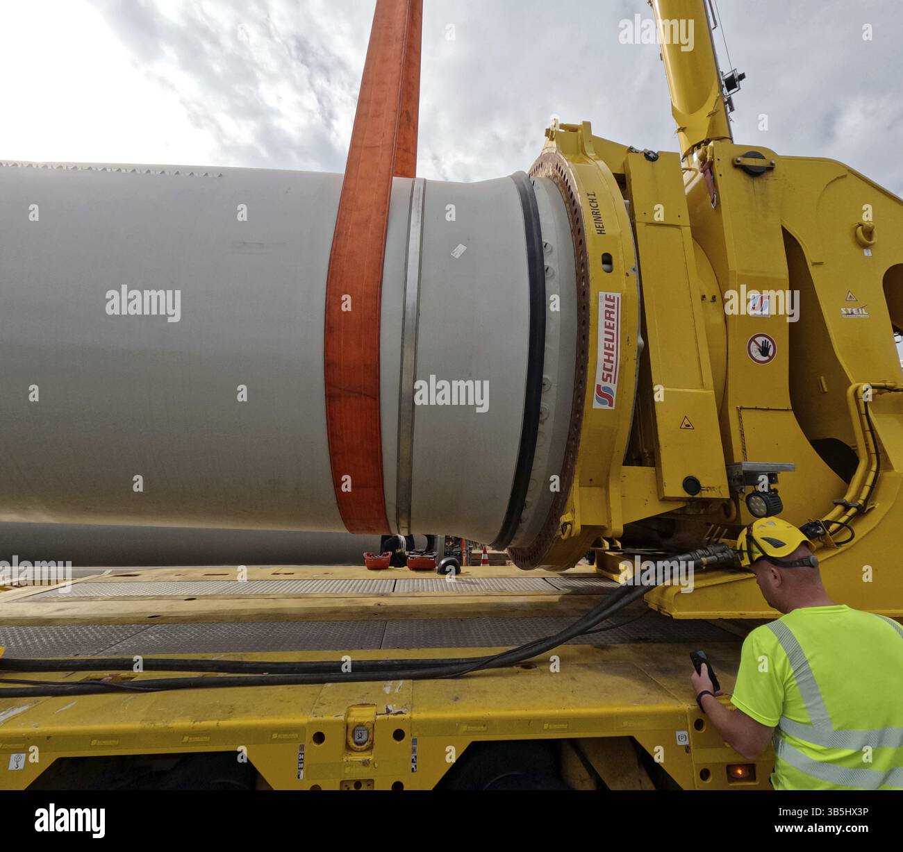 The rotor blades are mounted on a self-propelled transporter and travel ...