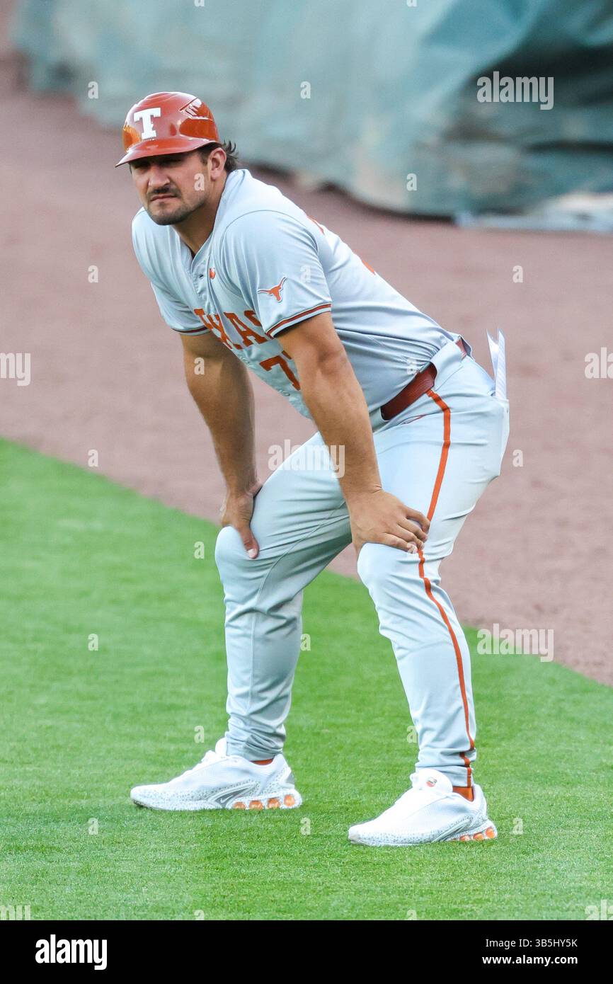 May 1, 2025: Texas first base coach Michael Cantu stares into the ...