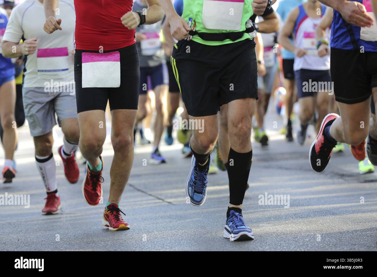 Marathon running race. Legs and bodies only. Unrecognizable people. The ...
