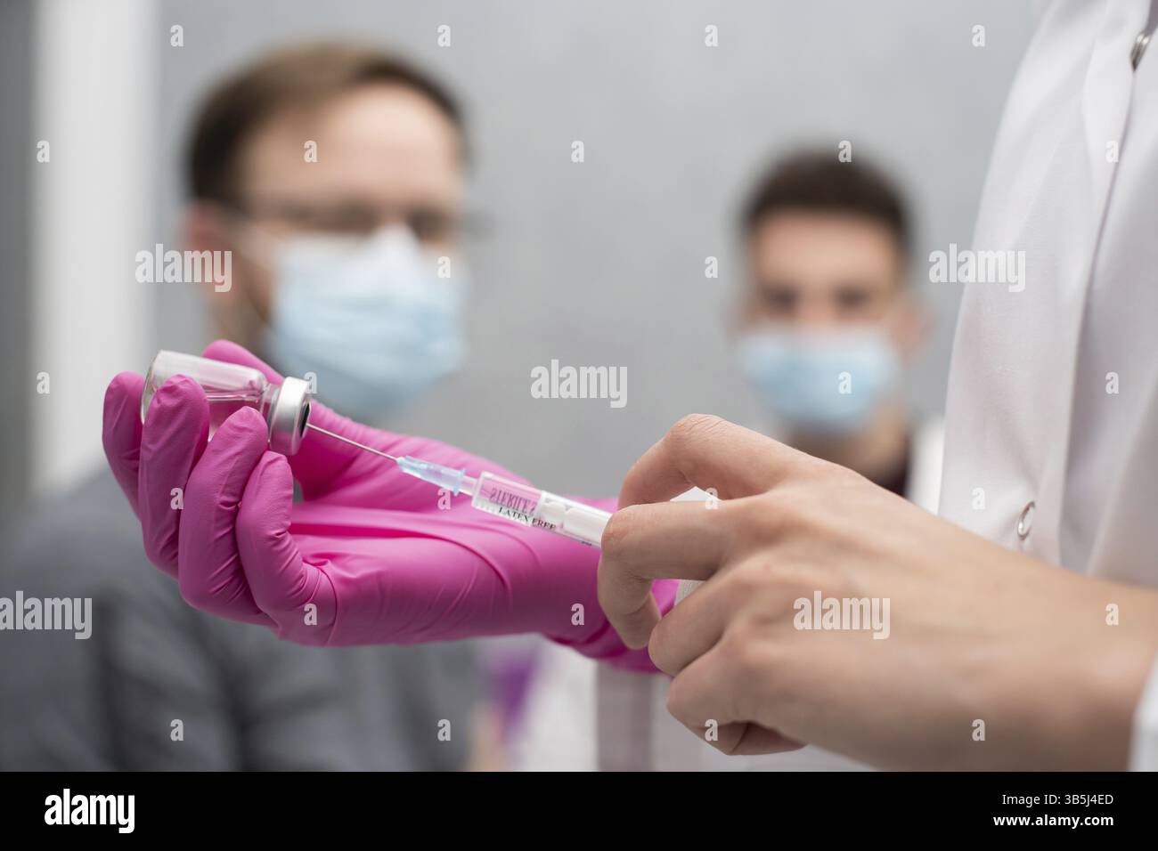 In a practical lesson, a young nurse shows medical trainees how to ...