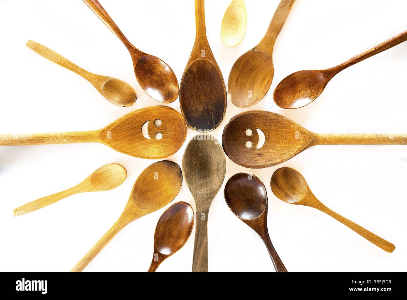 Wooden smiley face spoons on a white background. Studio shot. Set of ...
