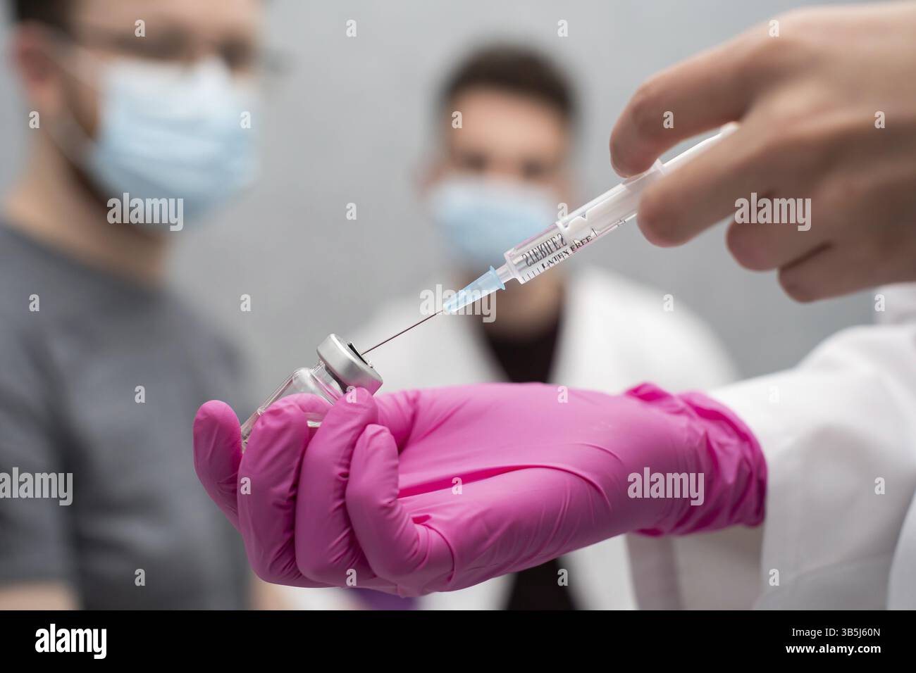 In a practical lesson, a young nurse shows medical trainees how to ...