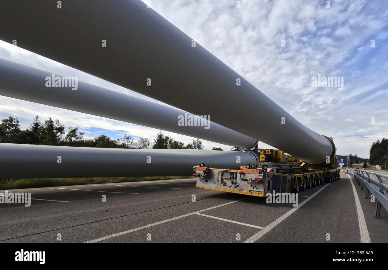Ready to go, the 68-metre-long rotor blade is attached to the 138-tonne ...