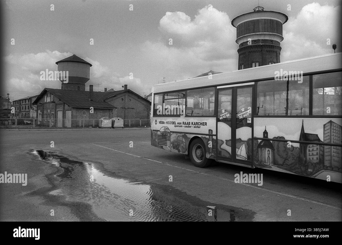 Germany, Angermuende, 20/04/1992, bus station, bus, puddle, Europe ...