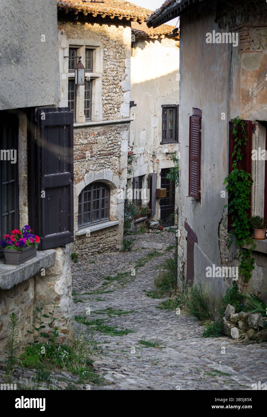 Narrow stone-paved streets lined with historic stone buildings and ...