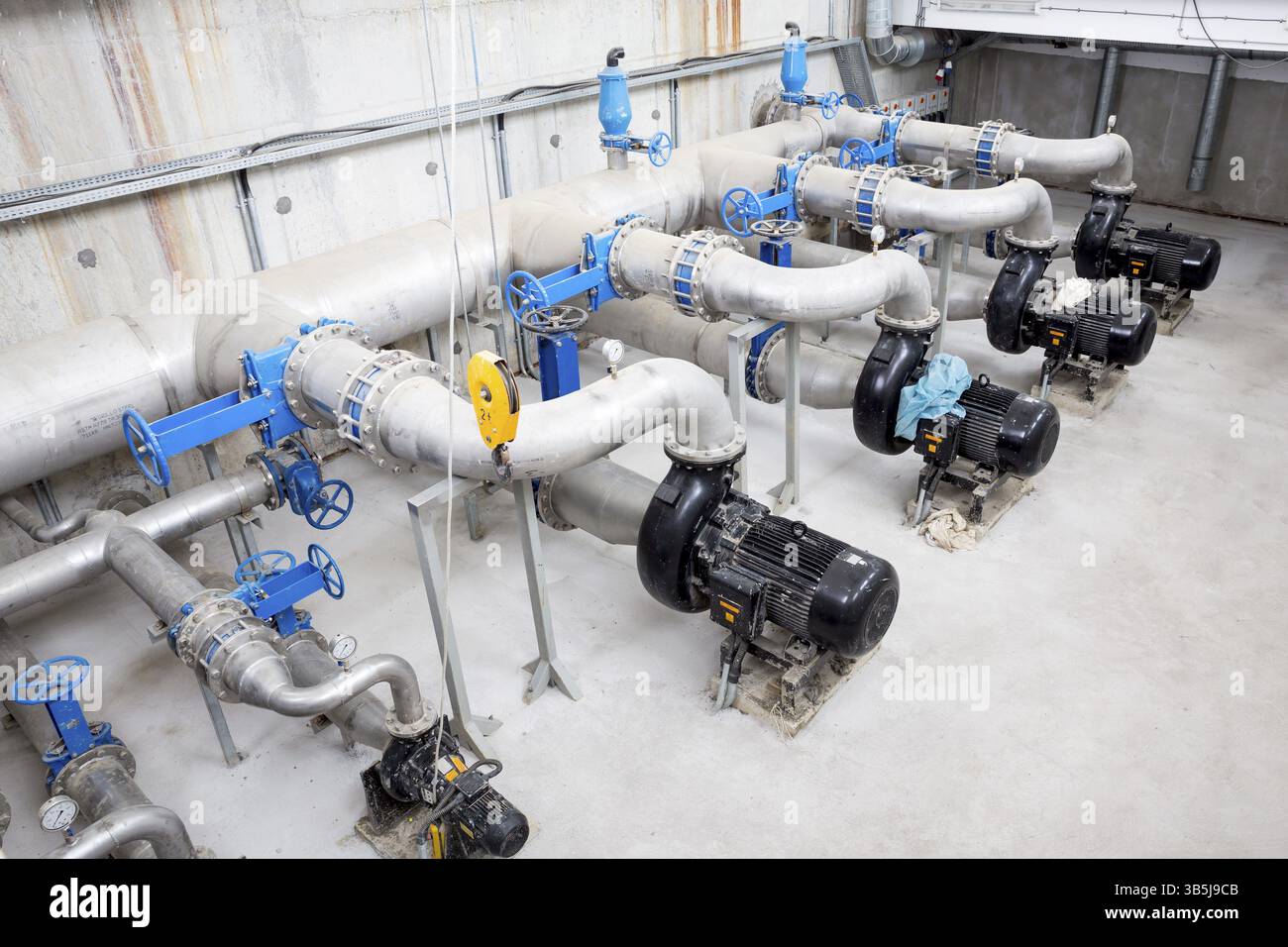 Wastewater treatment plant. A new pumping station. Valves and pipes. Urban modern treatment ...