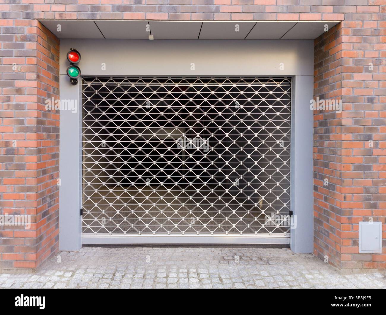 Modern metal security gate at parking entrance Stock Photo - Alamy