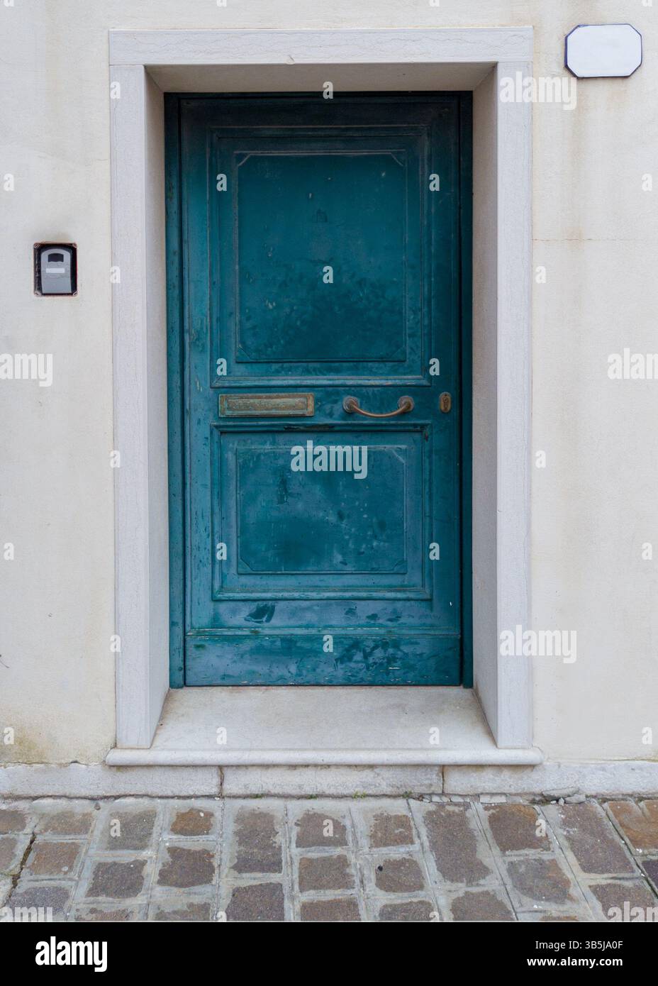 Old turquoise door with frame and intercom Stock Photo - Alamy
