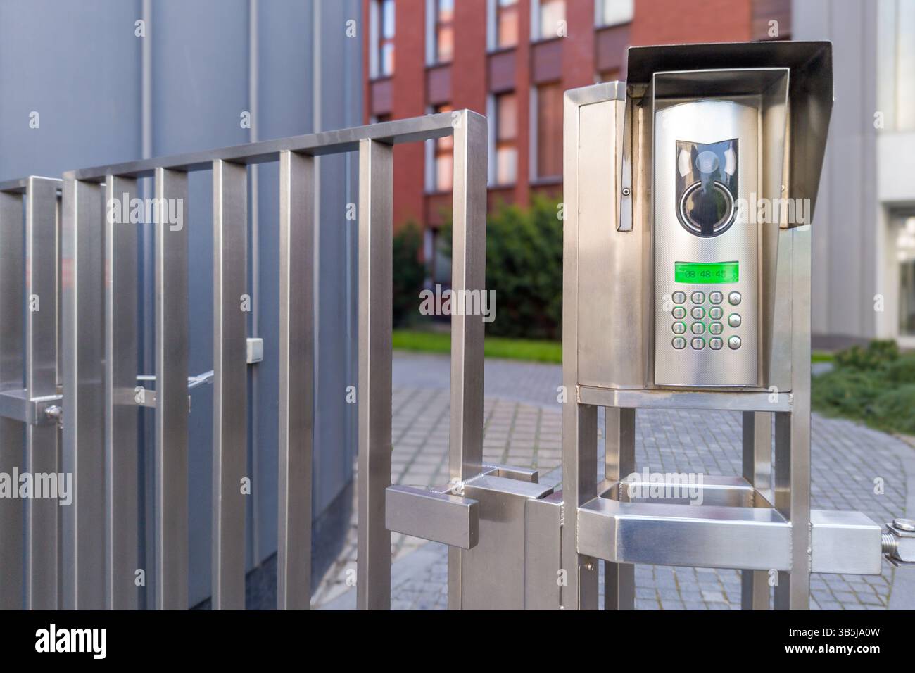 Secure entry gate with digital video intercom Stock Photo - Alamy