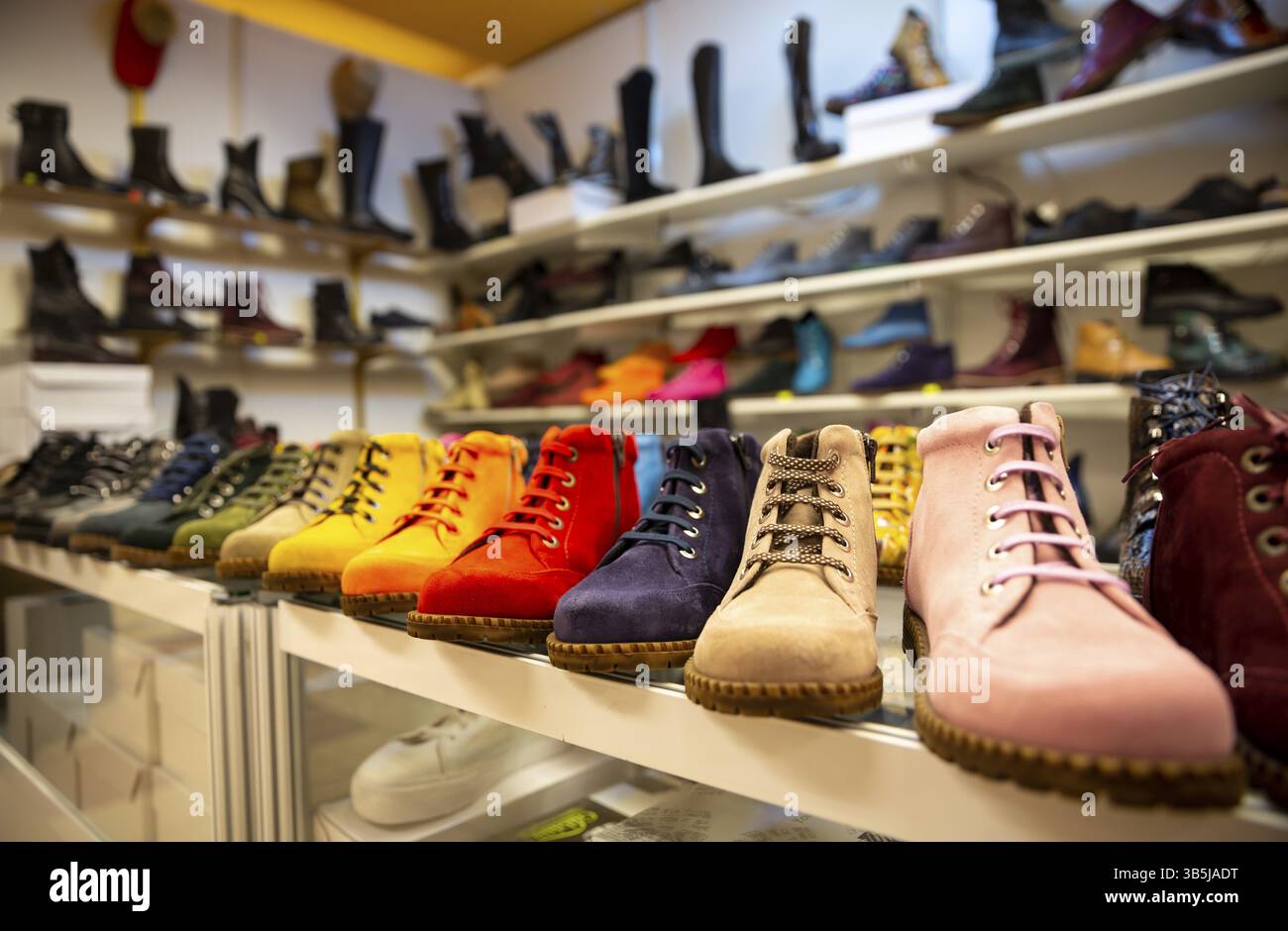 Colorful women boots/shoes are seen arranged Stock Photo - Alamy
