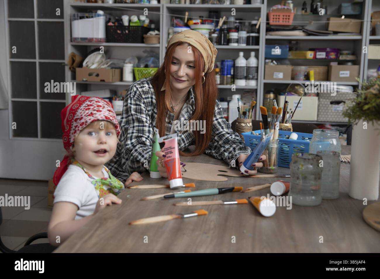 A delightful art session where a mother and child engage in creative ...
