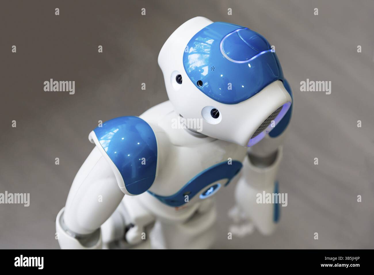 A small robot with human face and body - humanoid. Artificial ...