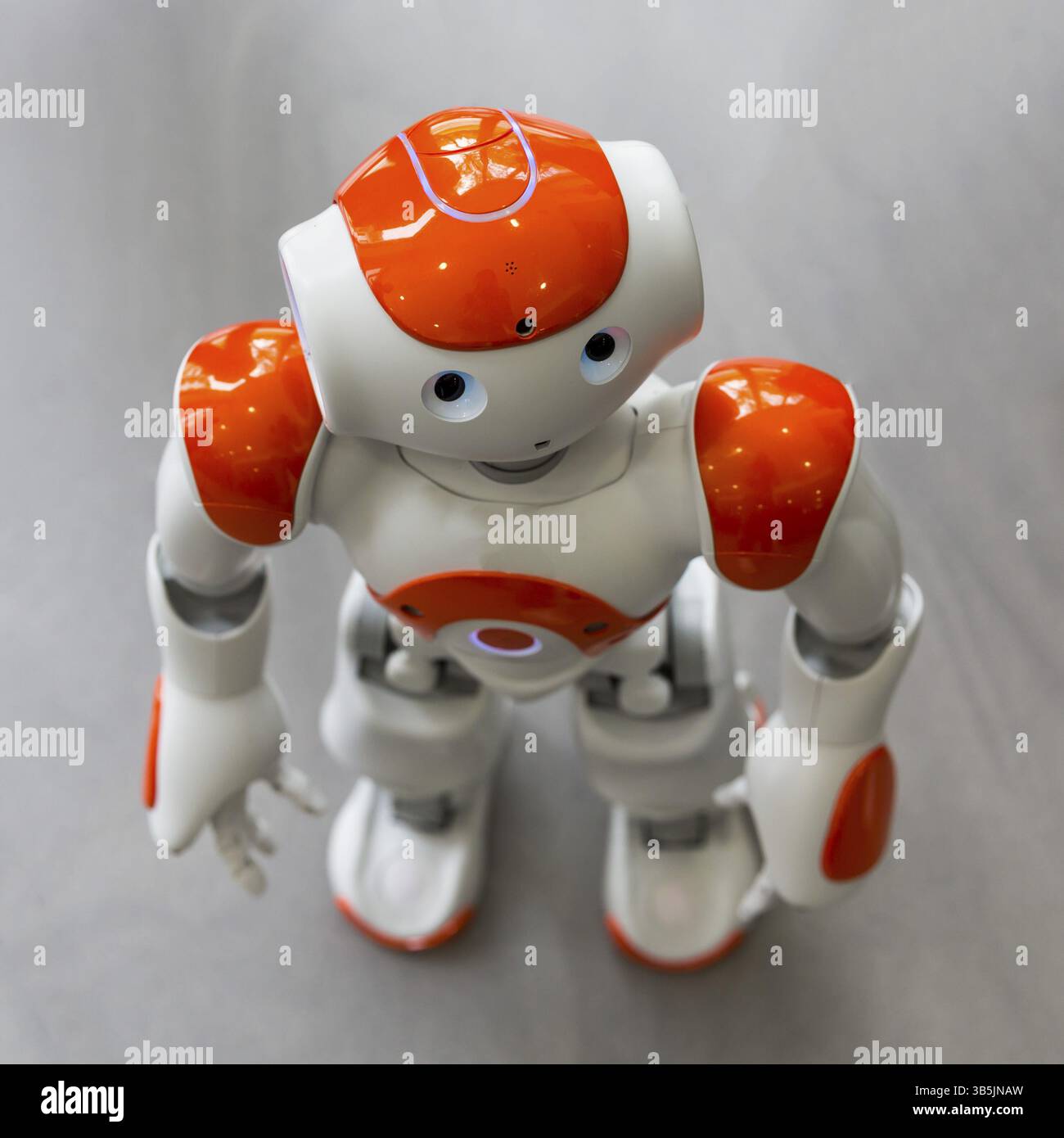 A small robot with human face and body - humanoid. Artificial ...