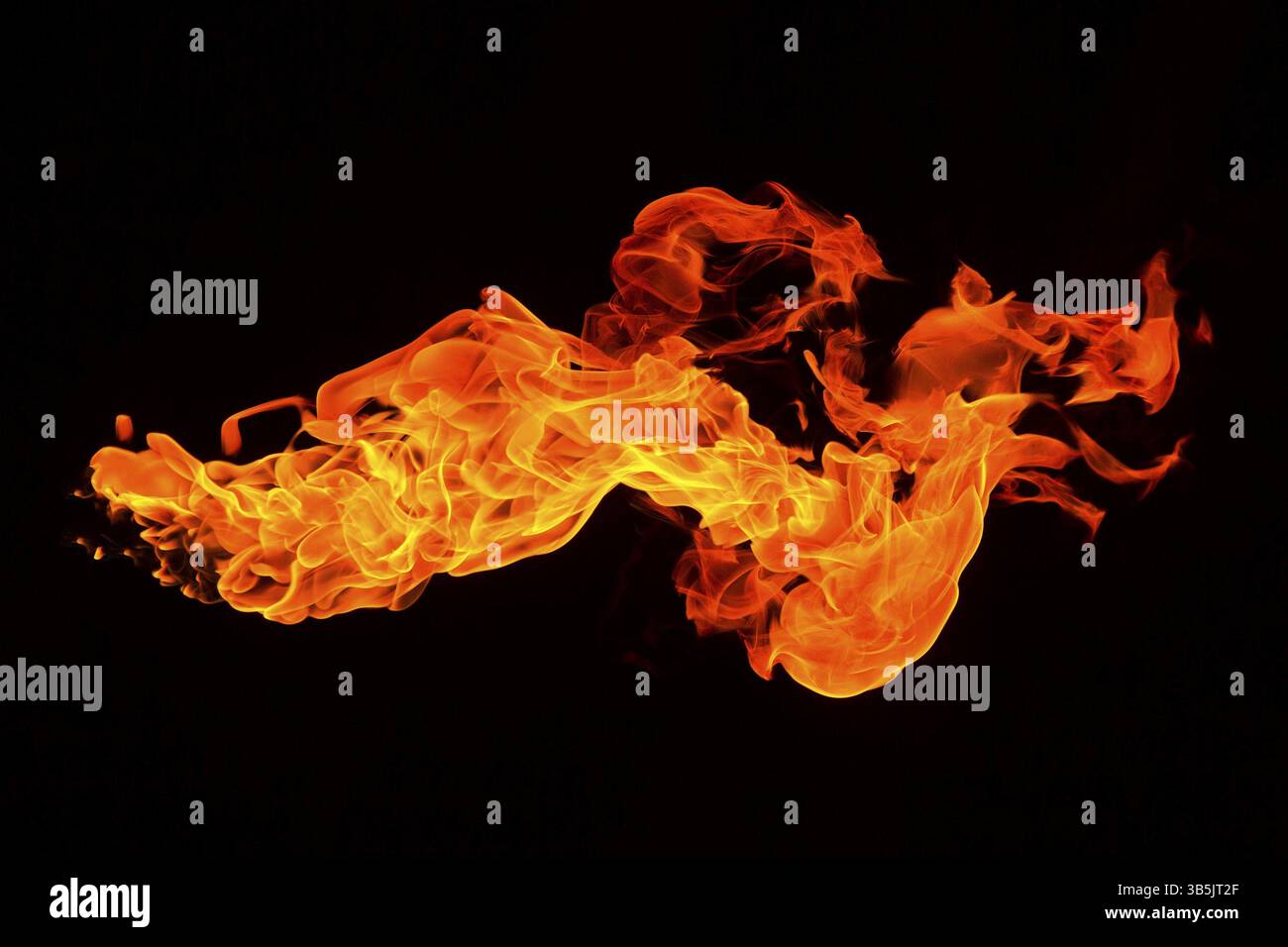 Burning flame isolated on a black background. Fire in red, orange and ...