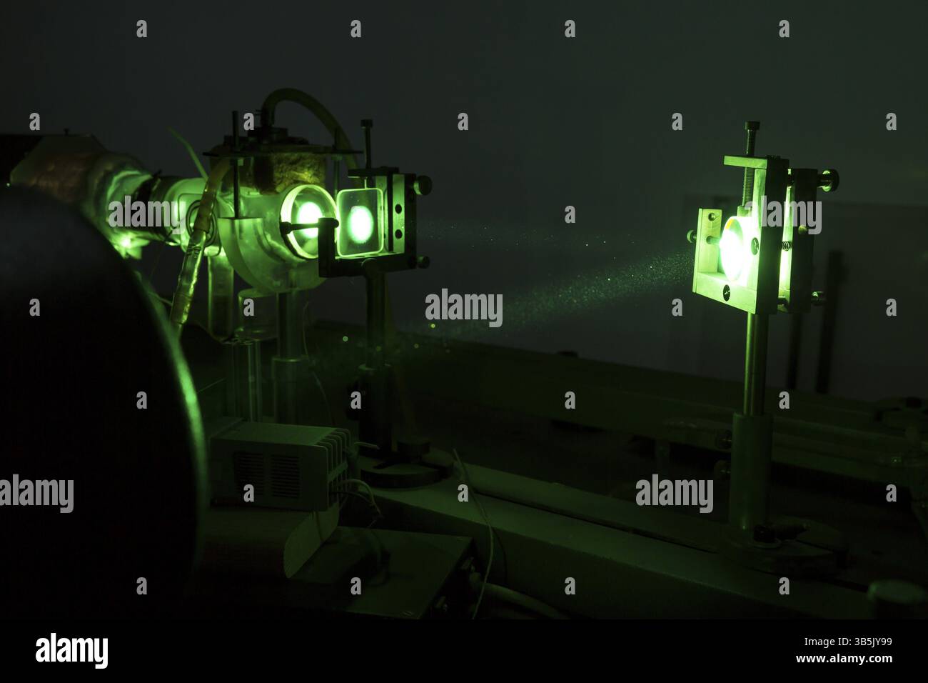 Powerful industrial green laser equipment in a laboratory for physics ...