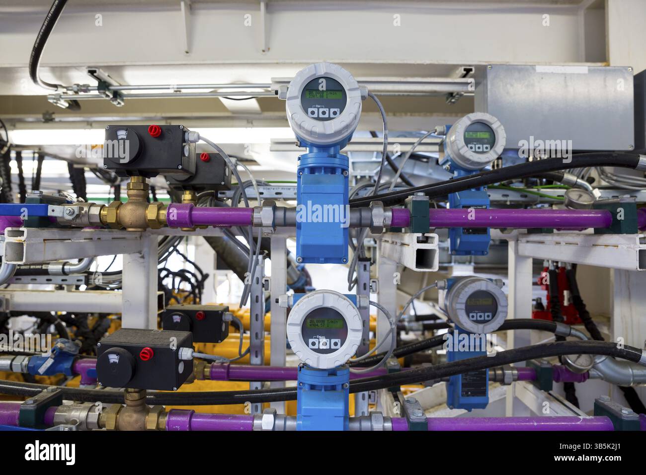 Pipes, cables and indicators of a big modern industrial subway drilling ...