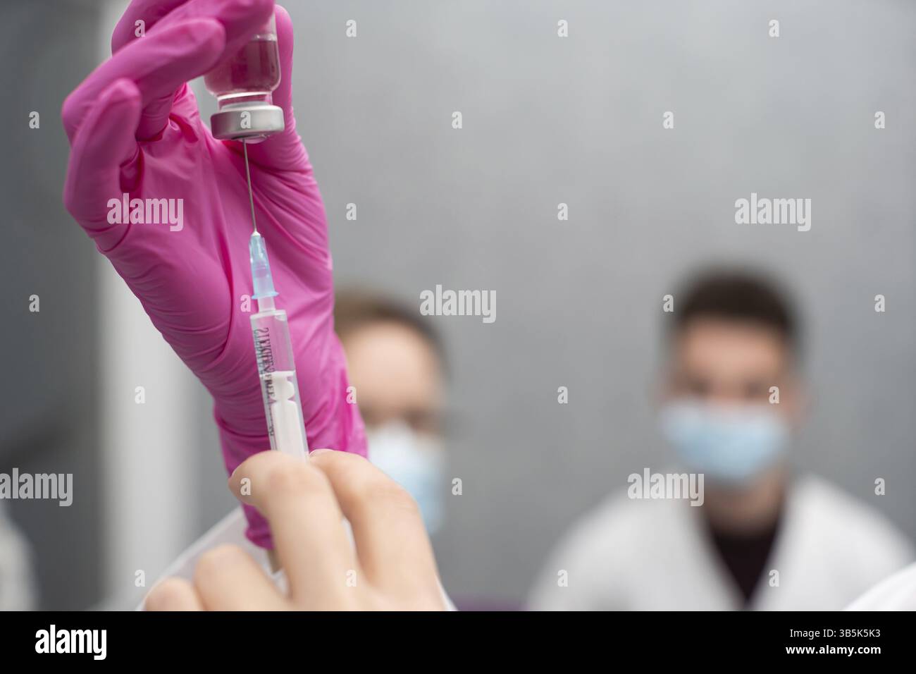 In a practical lesson, a young nurse shows medical trainees how to ...