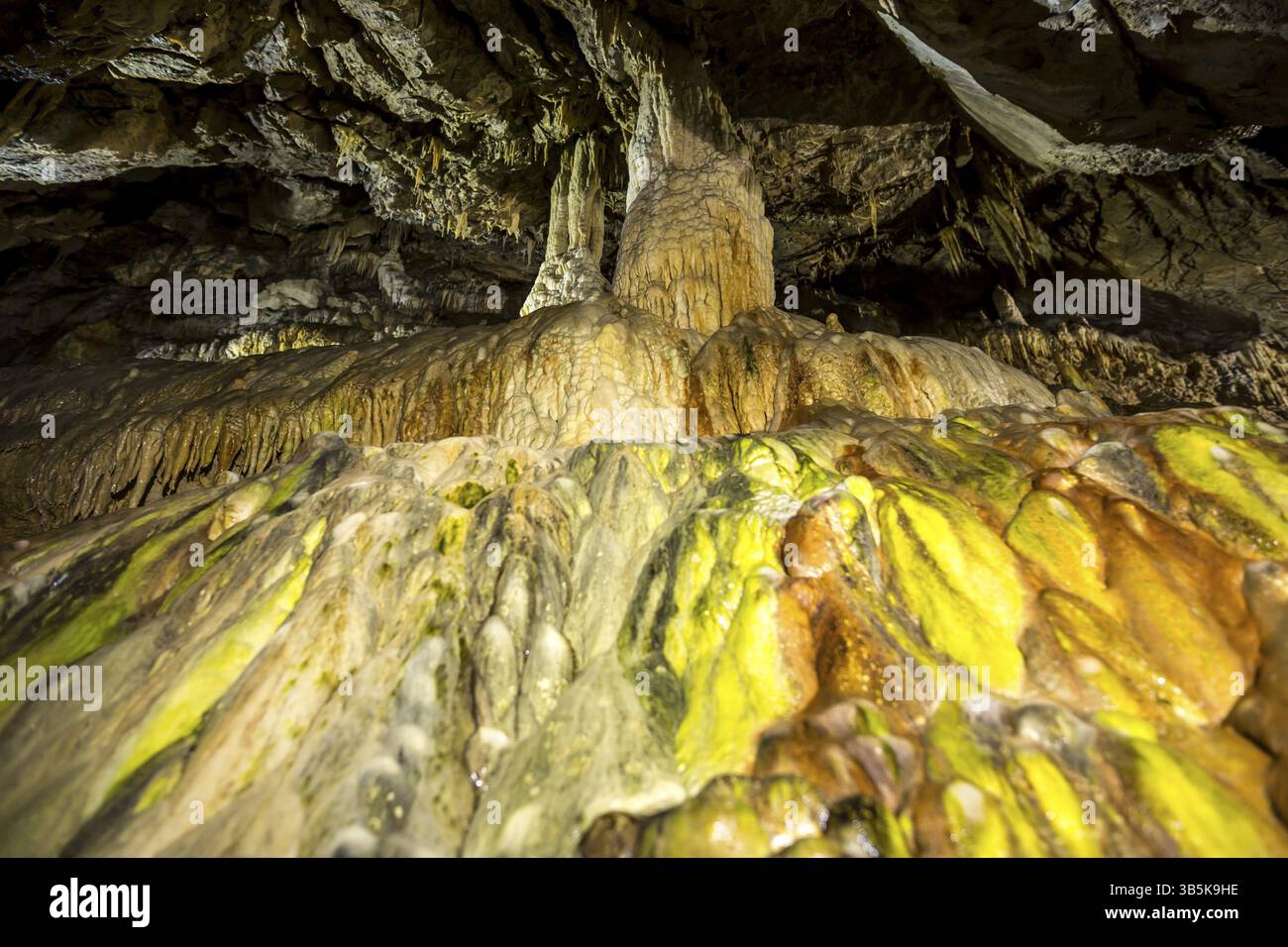 Inside of a beautiful colourful cave. Flowstones, stalactites and ...