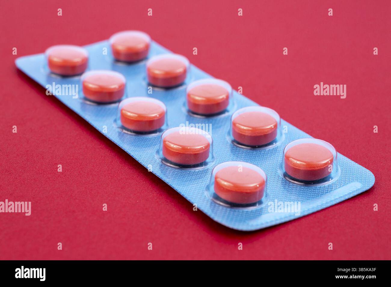 Red pills in blue plastic pack - blister. Global pharmaceutical ...